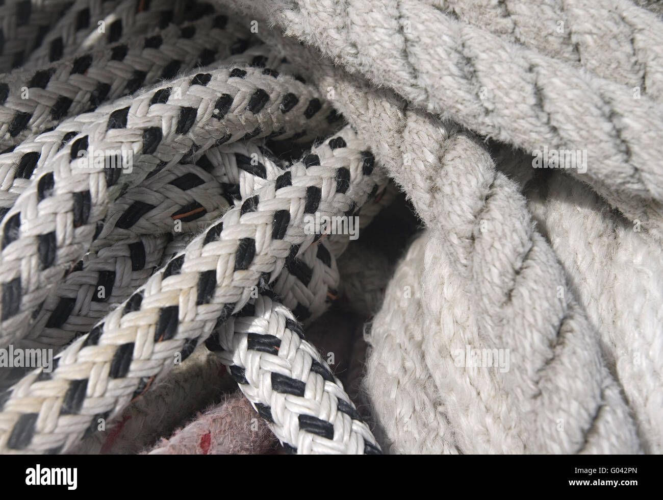 Close-up of thick textile ropes laying on a ship's deck Stock Photo - Alamy
