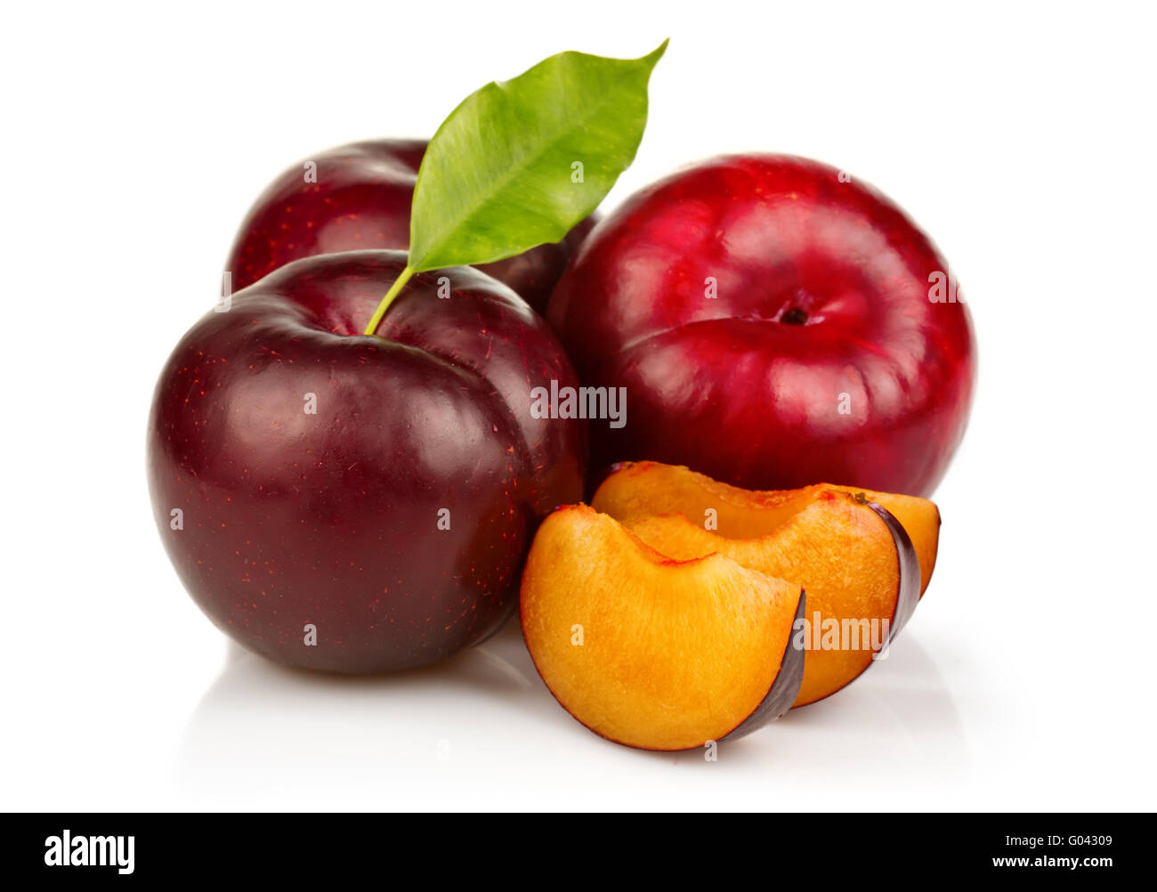 Ripe plums fruit with slices isolated on white Stock Photo - Alamy