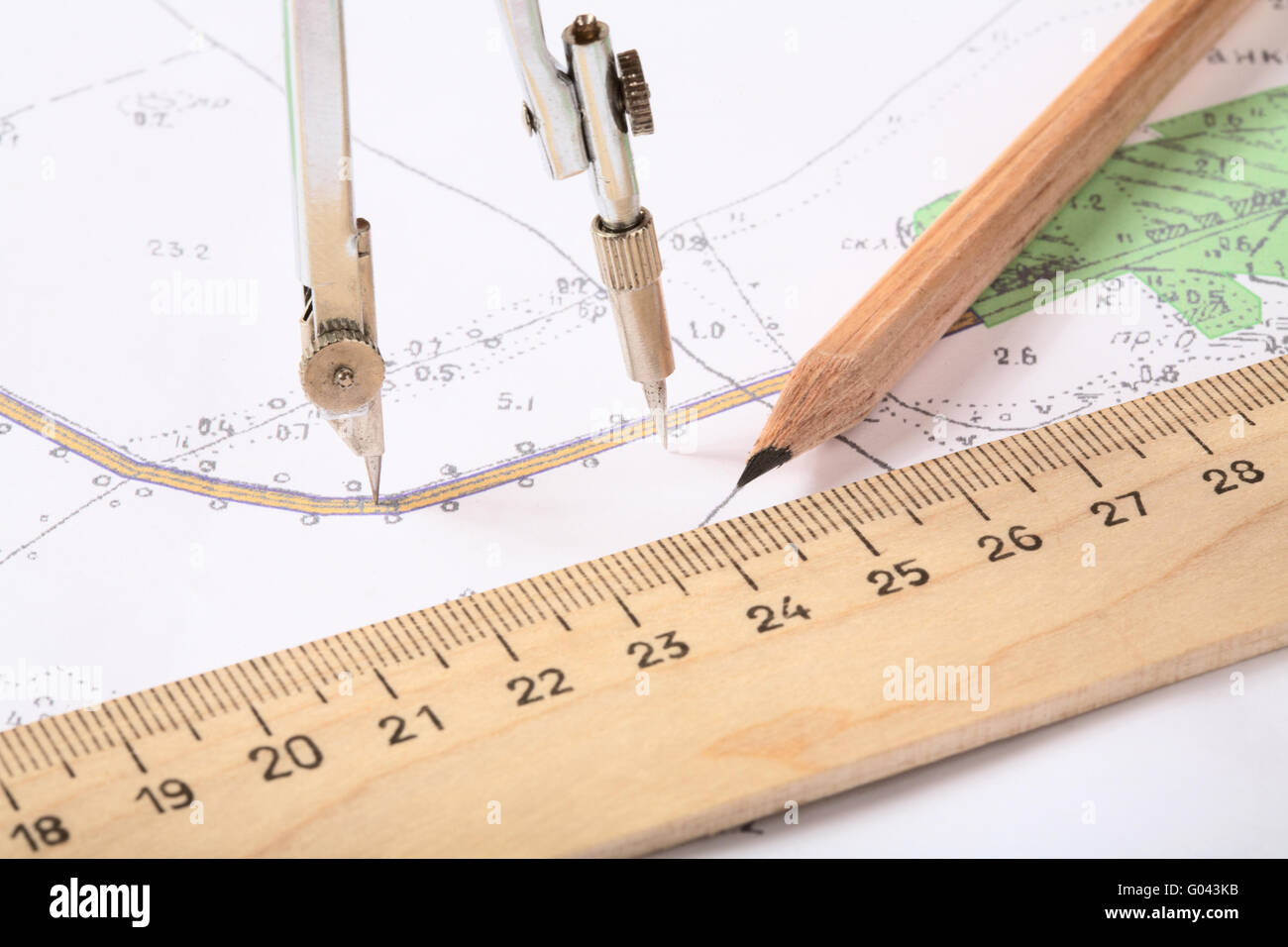 Topographic map of district with measuring instrument Stock Photo - Alamy