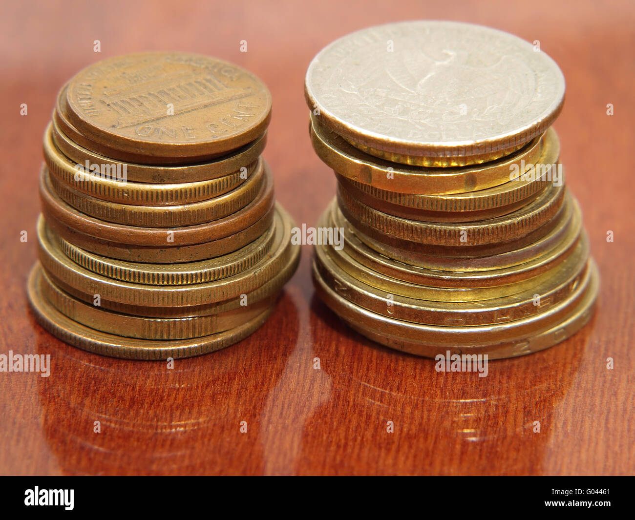 Two piles of coins Stock Photo - Alamy