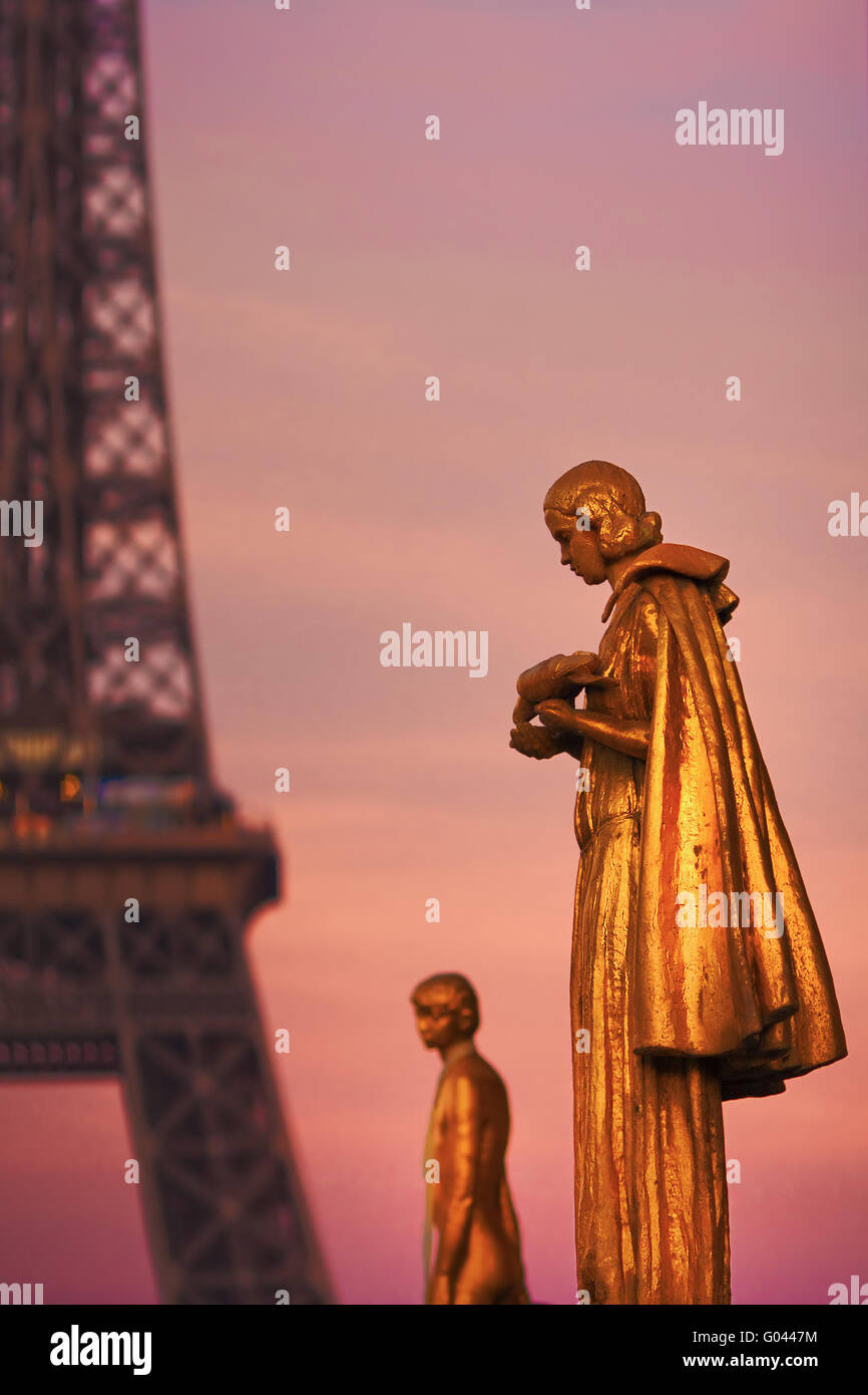 glowing statues in front of the Eiffel tower Stock Photo - Alamy