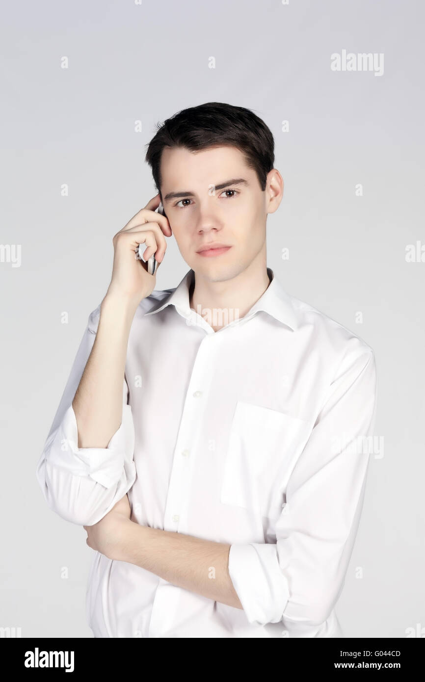young man talking on phone Stock Photo - Alamy