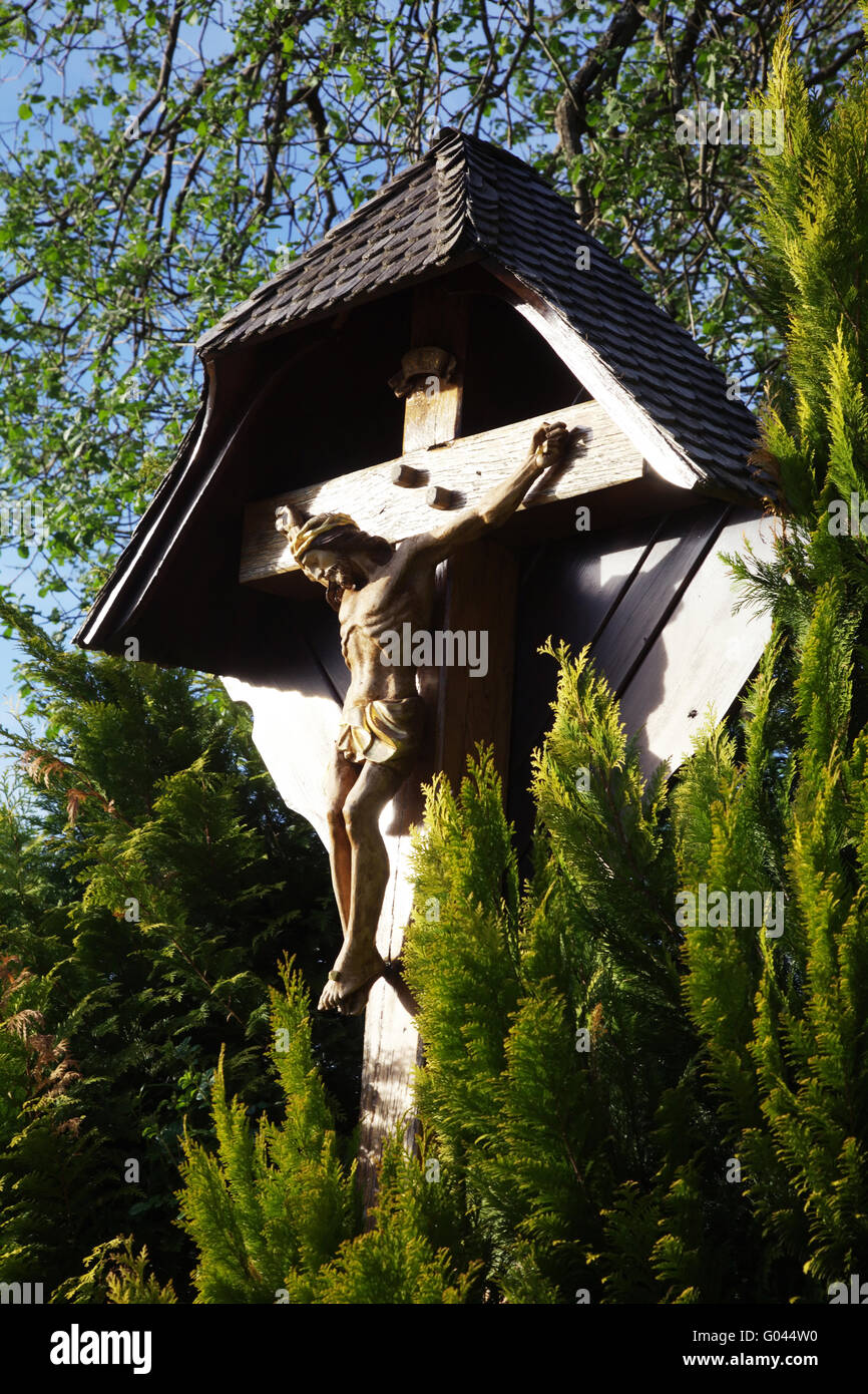 Praying by wayside cross hi-res stock photography and images - Alamy