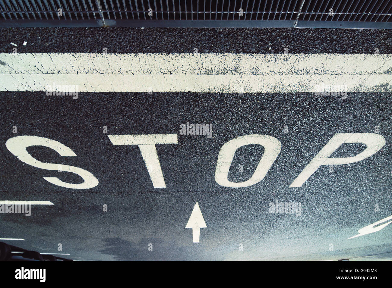 warning STOP sign on the pavement at the car par Stock Photo - Alamy
