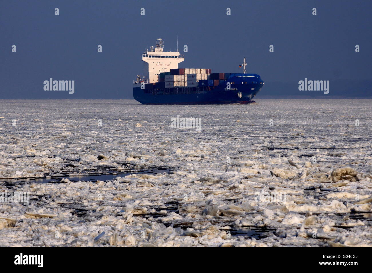 Containervessel in ice Stock Photo - Alamy