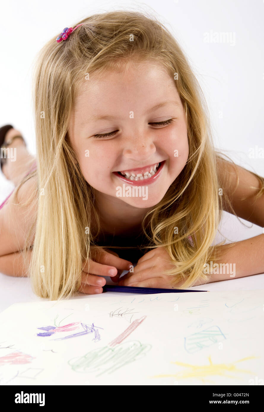 Little girl drawing on paper Stock Photo - Alamy