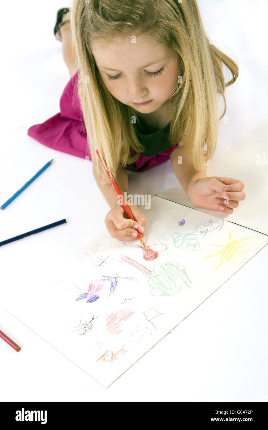 Little girl drawing on paper Stock Photo - Alamy