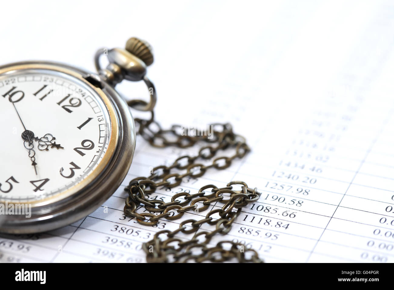 Business concept. Closeup of pocket watch on paper background with ...