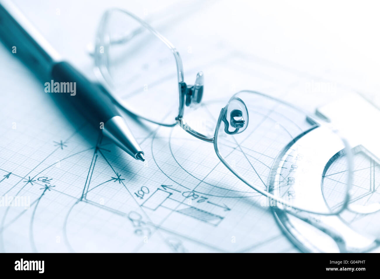 Pen and spectacles near ruler on graph paper with chart Stock Photo - Alamy