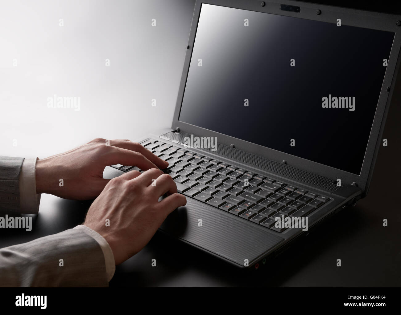 Working on laptop Stock Photo - Alamy
