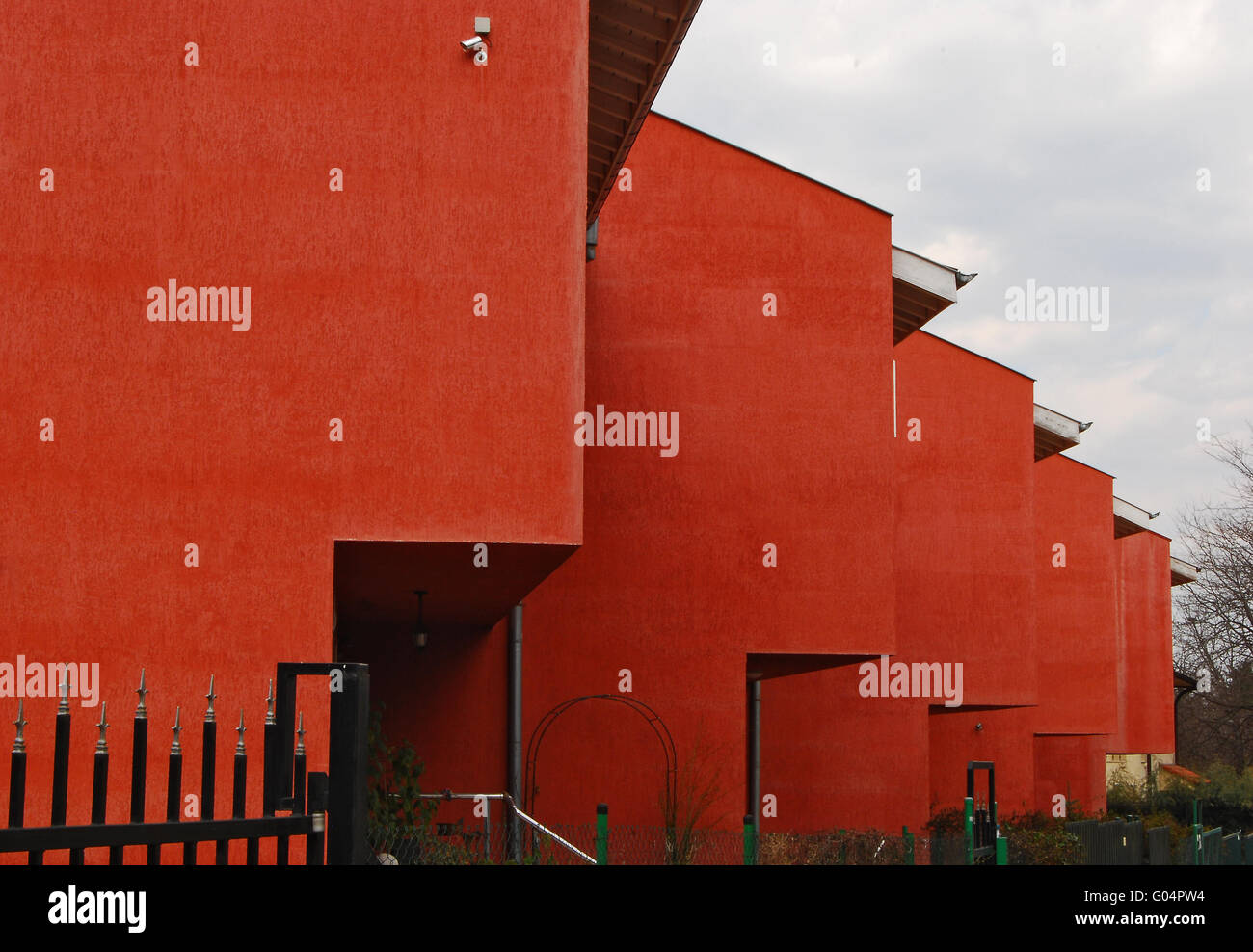 Red painted family houses side-ward view in perspe Stock Photo - Alamy