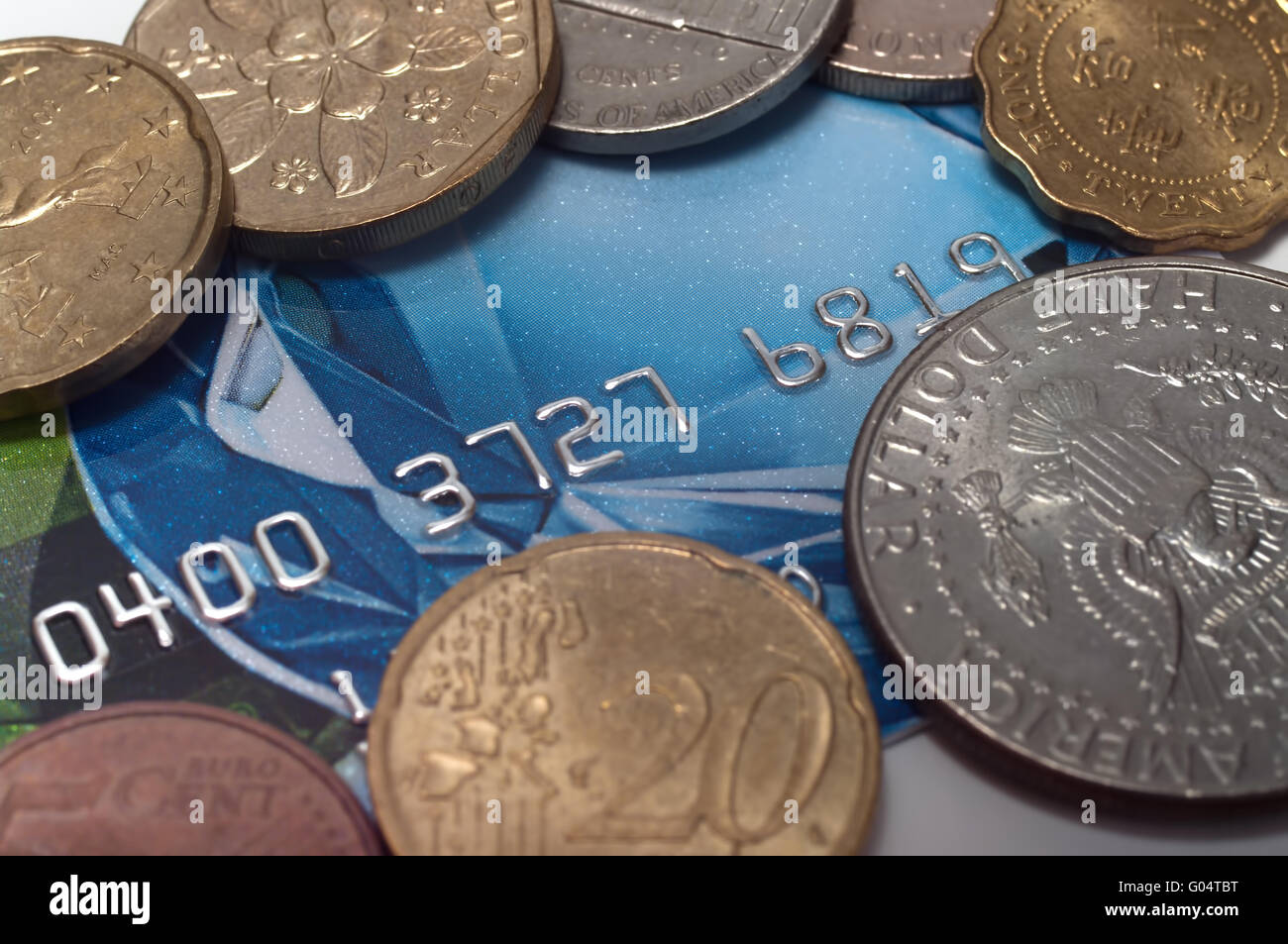 credit card and a few coins Stock Photo - Alamy