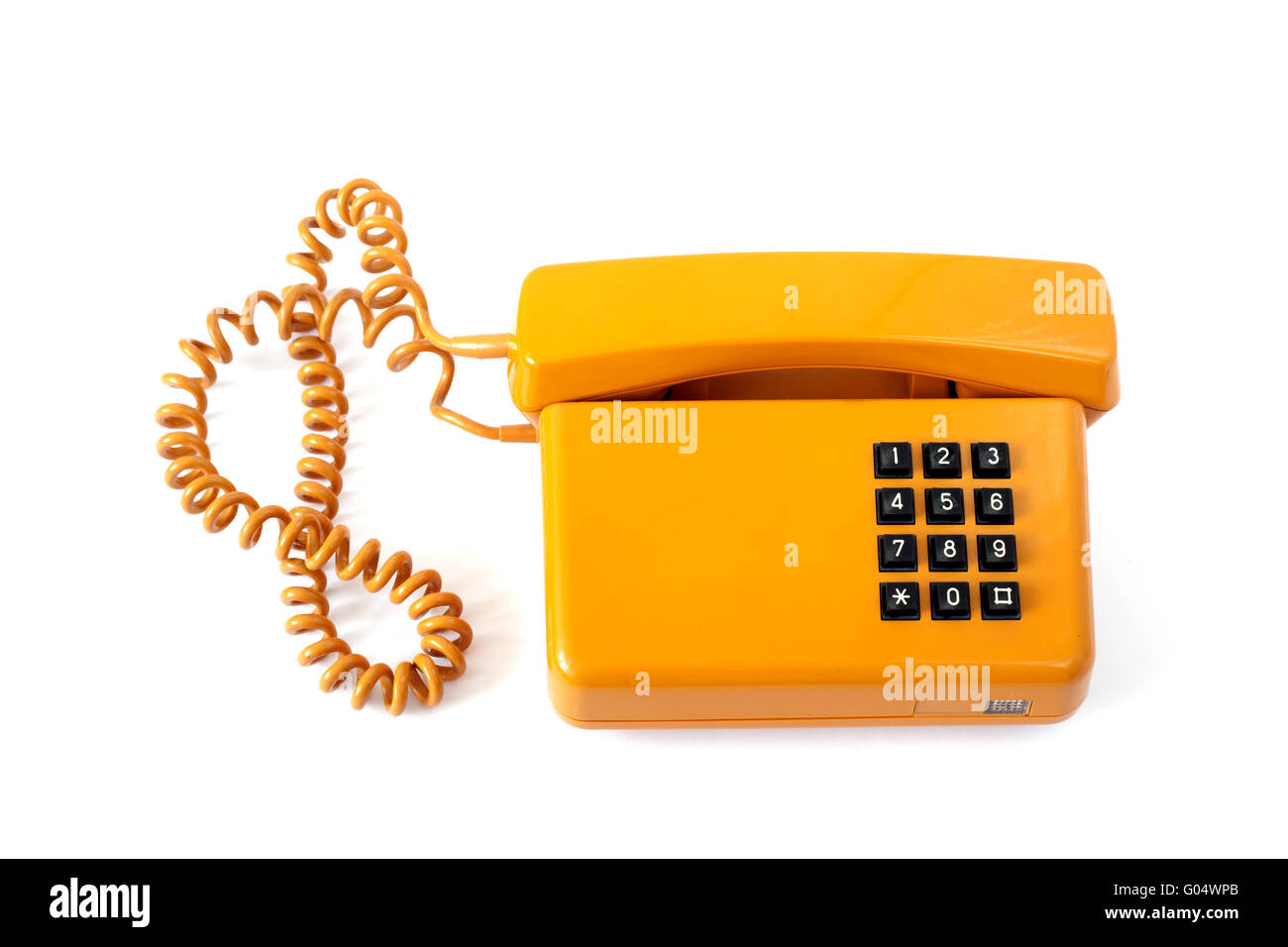 Old orange telephone isolated on white background Stock Photo - Alamy