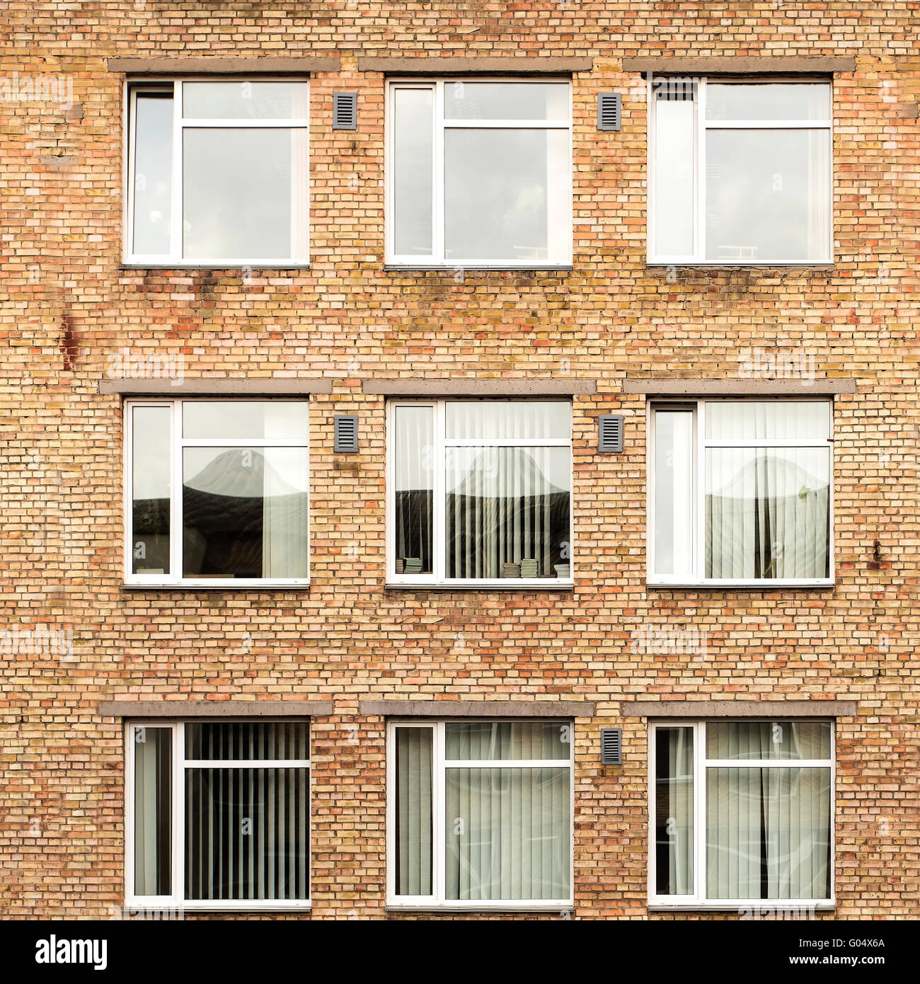 Wall of a residential block of flats with balconies windows Stock Photo ...