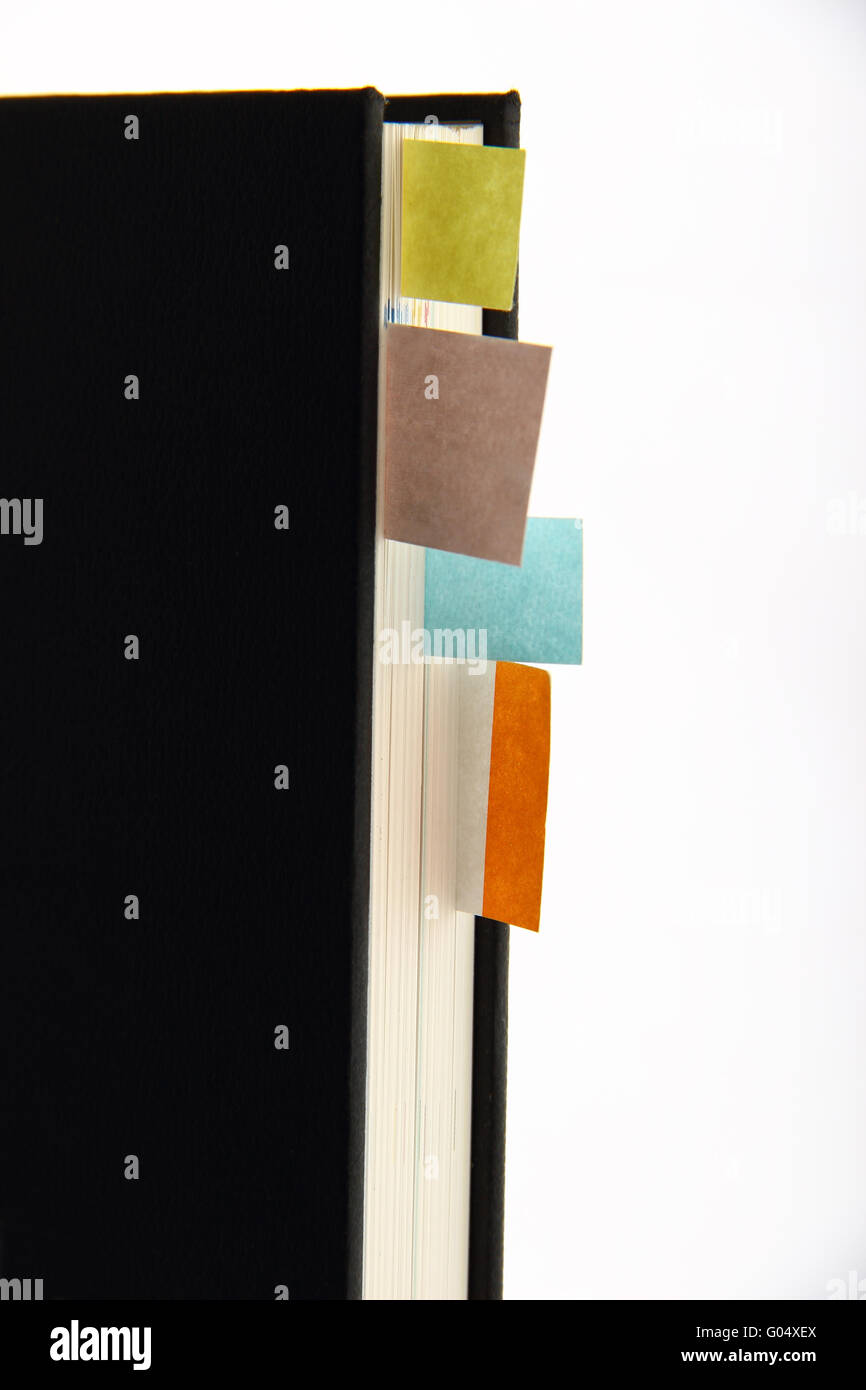 book with post it notes as bookmarks Stock Photo - Alamy