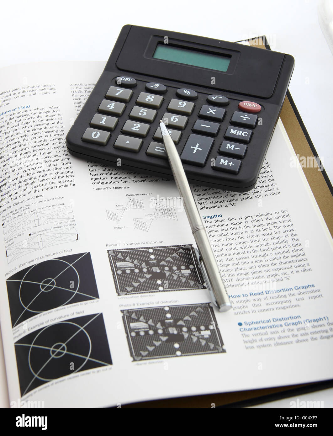 book calculator and pen Stock Photo - Alamy