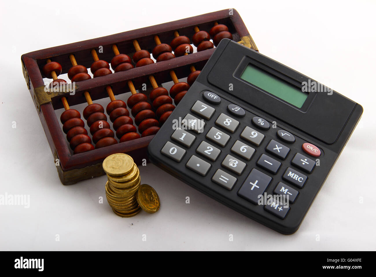 traditional abacus modern calculator and coins Stock Photo - Alamy