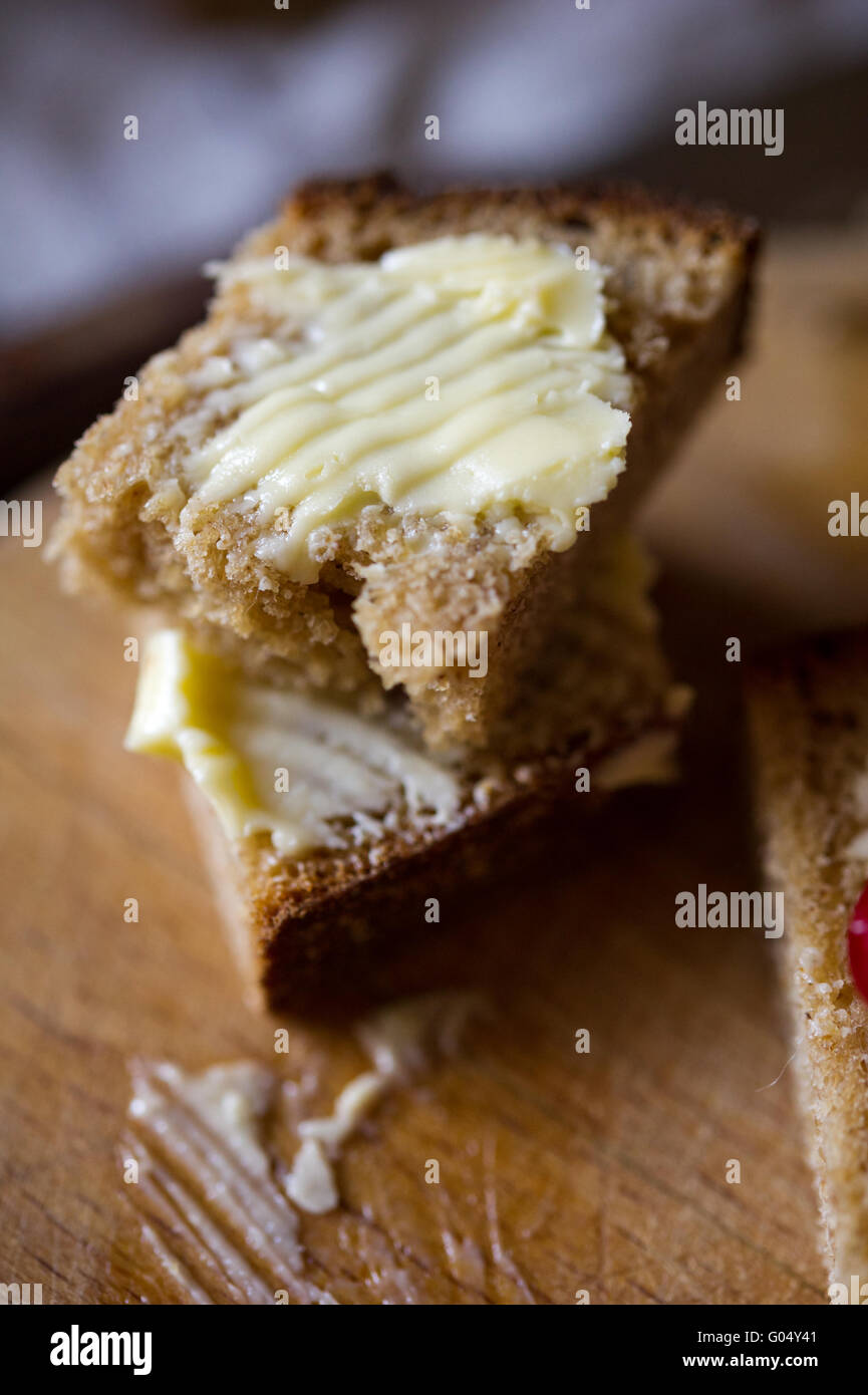 Small sliced piece of wheat bread and butter Stock Photo - Alamy
