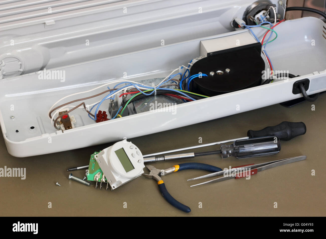 Repair of an electric oil thermal heater Stock Photo - Alamy