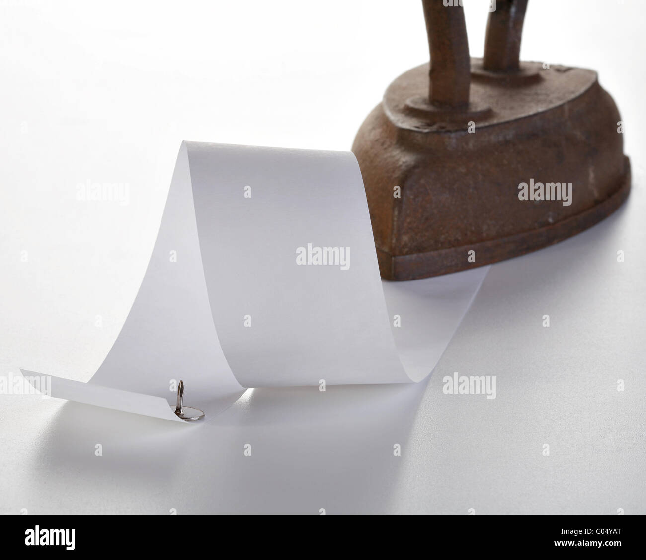 Old iron a strip of a paper and the button Stock Photo - Alamy