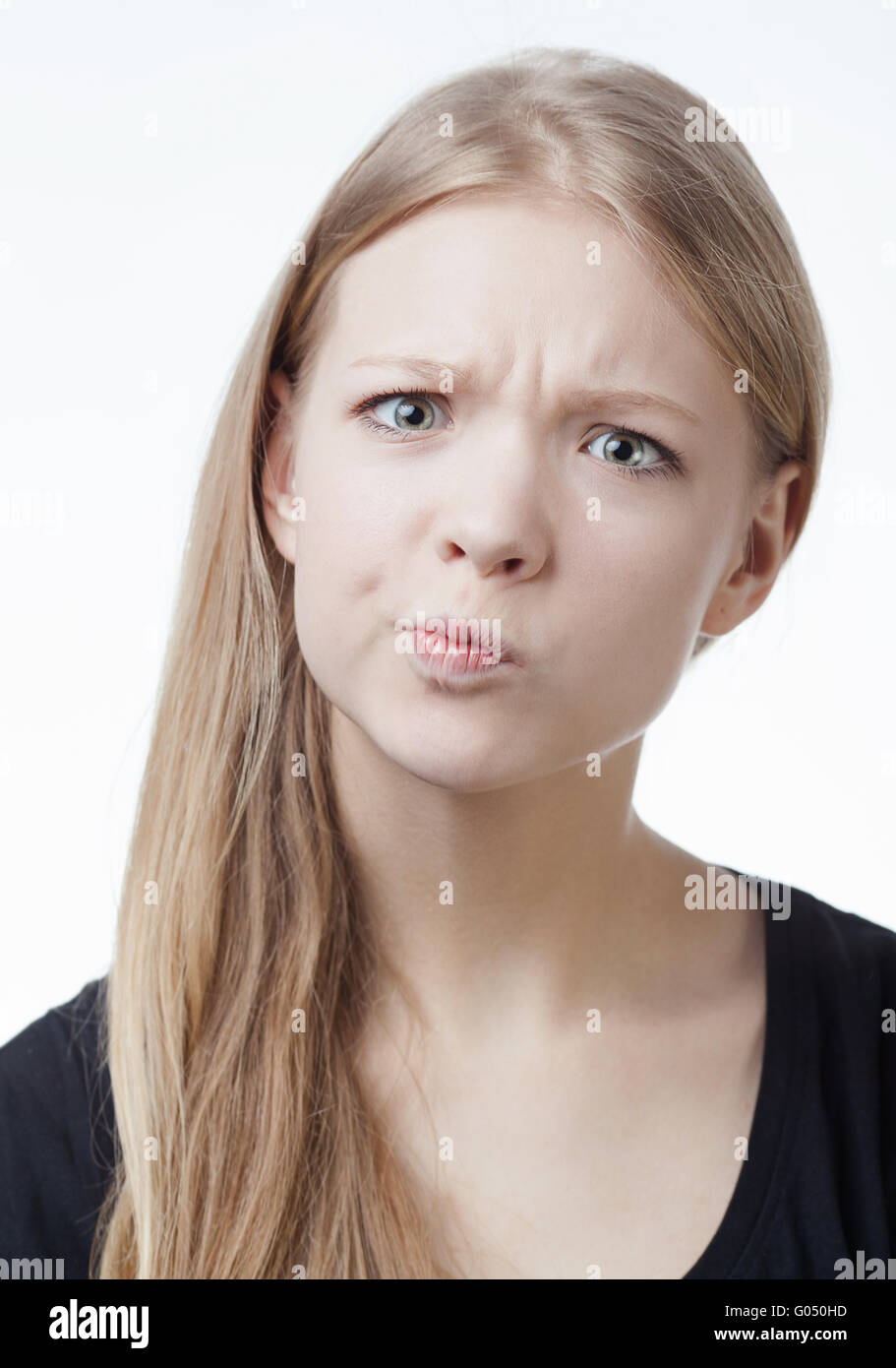 beautiful teen girl grimacing Stock Photo - Alamy