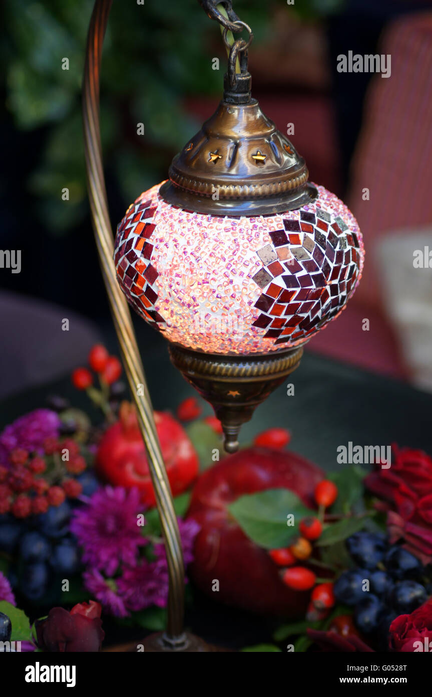 Closeup of mosaic lamp in arabic style with autumn fruits and ...