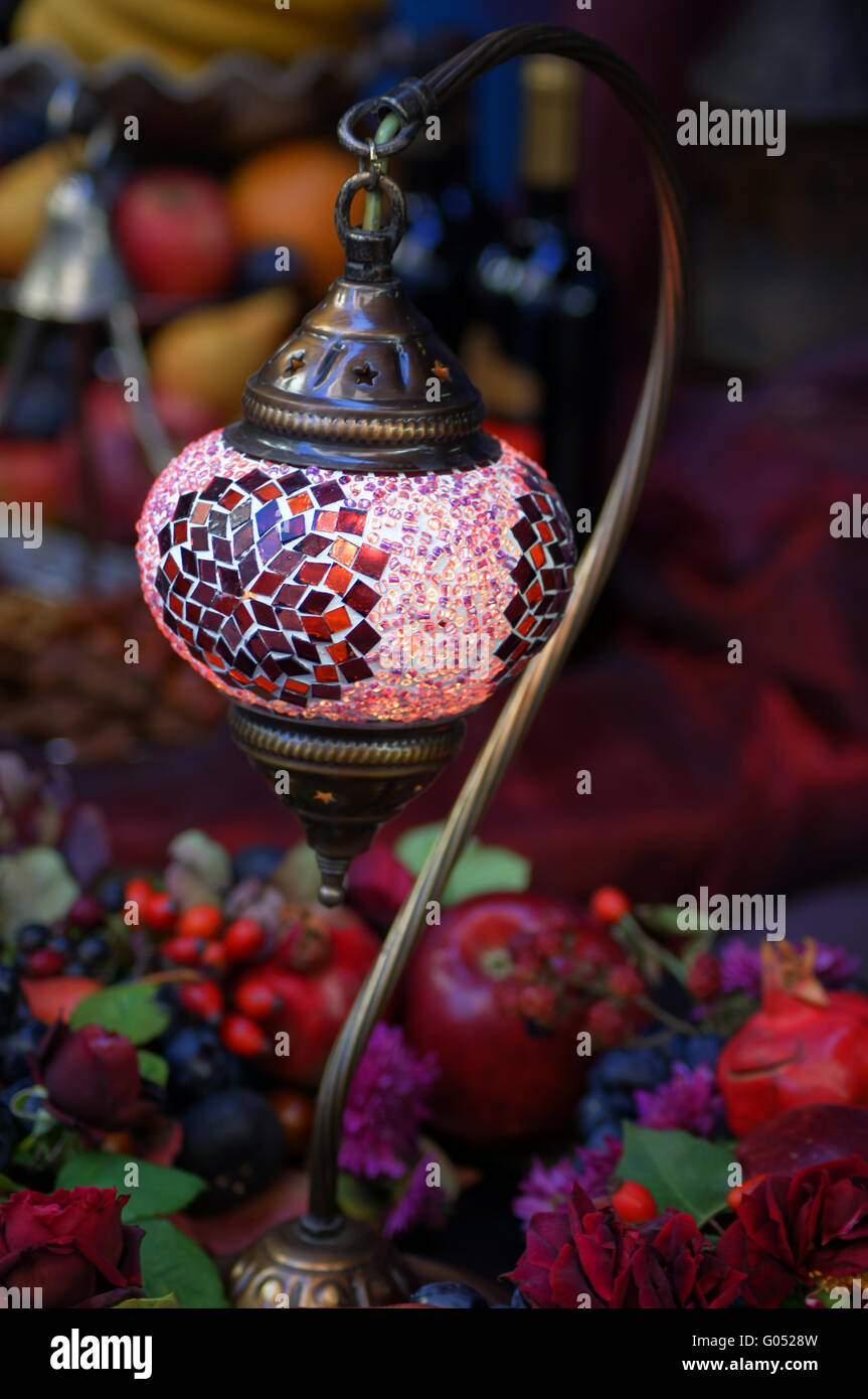 Closeup of mosaic lamp in arabic style with autumn fruits and ...