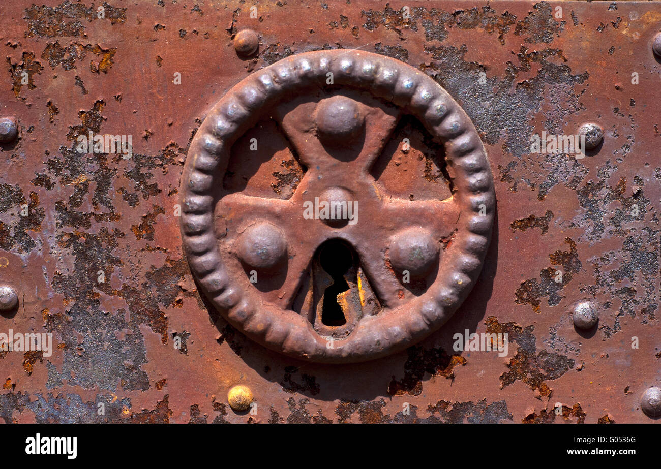 Old rusty shutter lock keyhole extreme closeup Stock Photo - Alamy