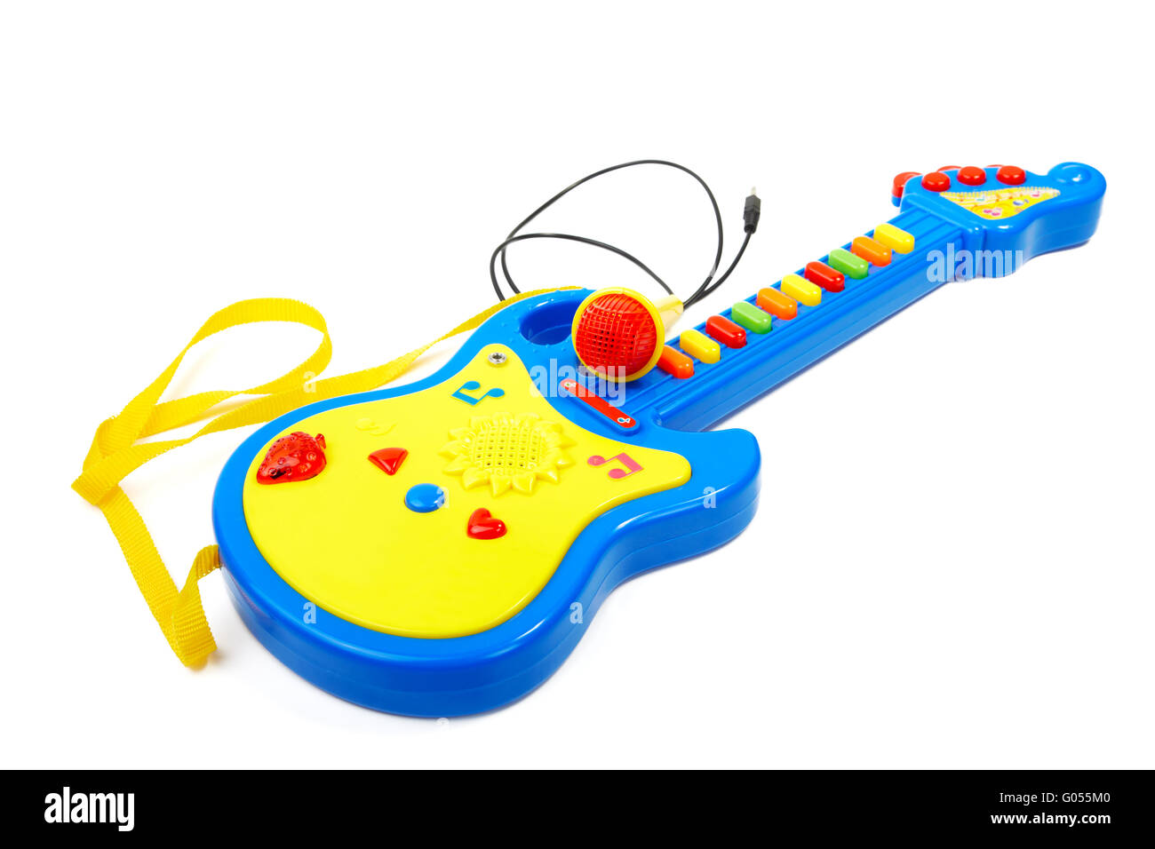 Children's toy guitar with microphone isolated on a white background ...