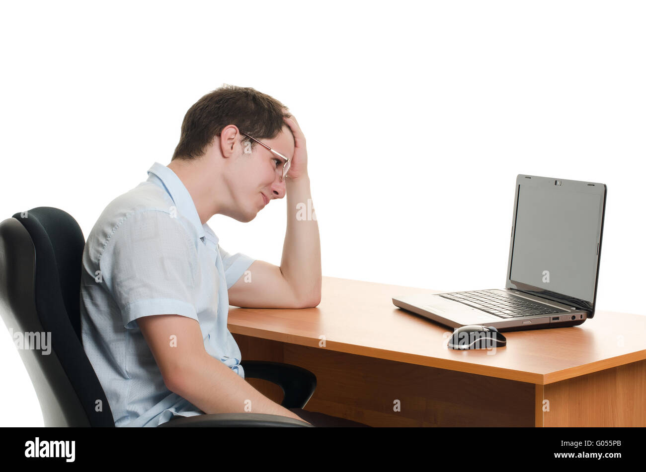 The businessman behind a table with the computer Stock Photo - Alamy