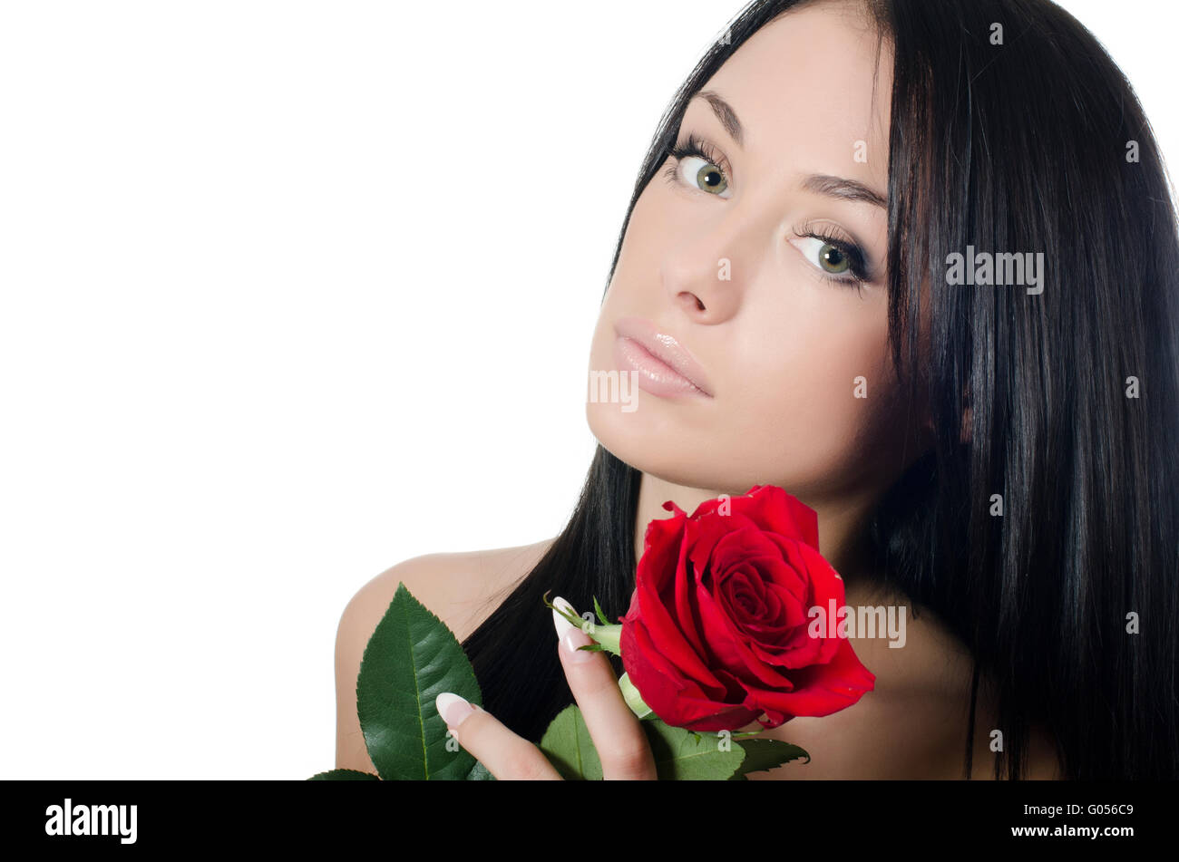 The girl with beautiful hair with a red rose Stock Photo - Alamy