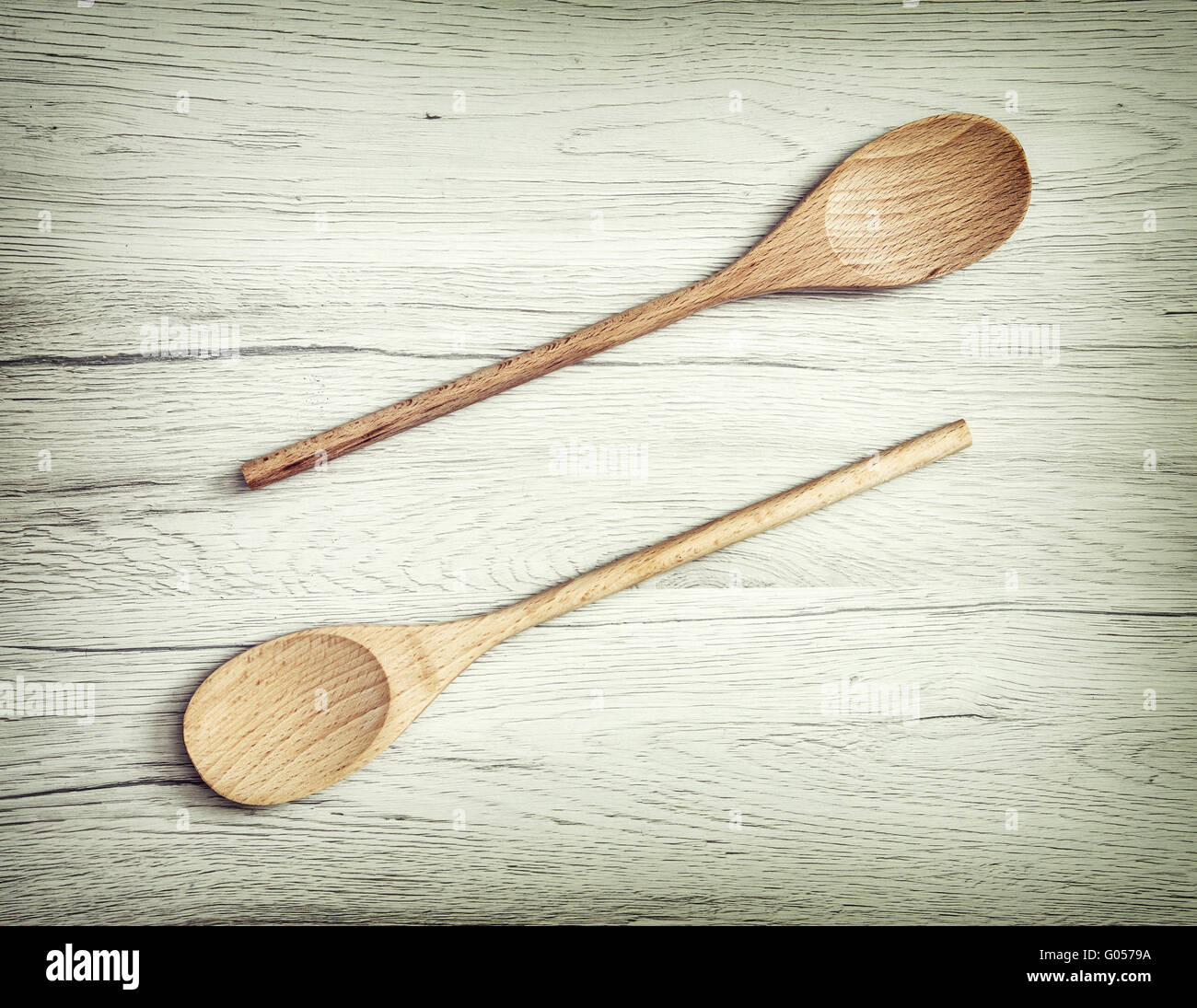 Two wooden spoons on the white background. Kitchen equipment. Wooden ...