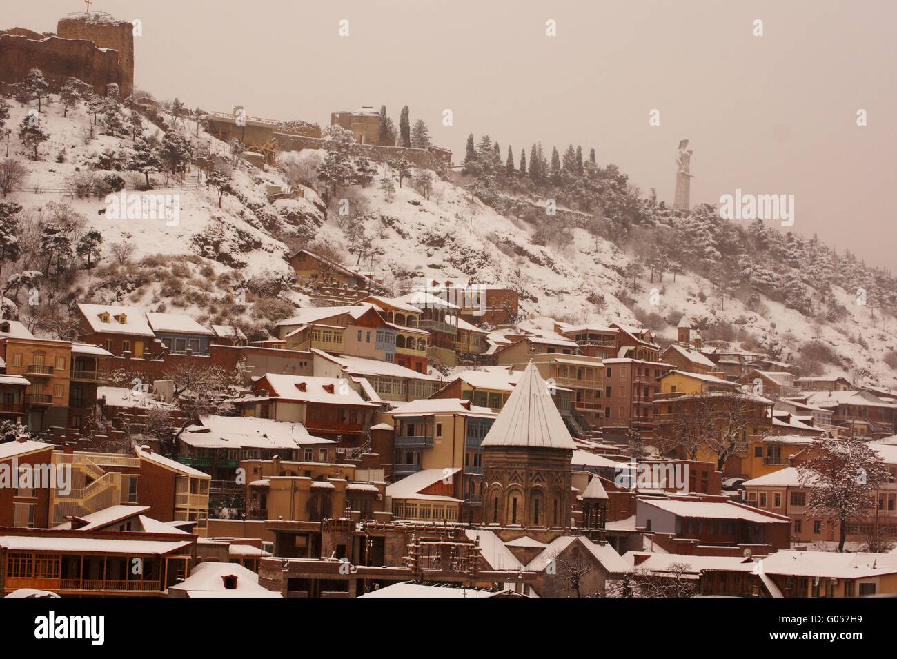 Winter view to covered with snow Tbilisi Old town in misty day Stock ...