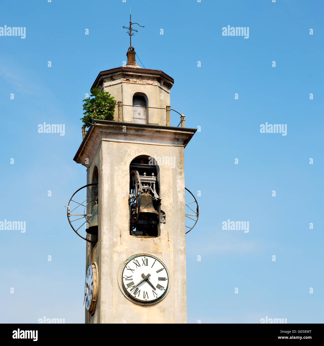 ancien clock tower in italy europe old stone and bell Stock Photo - Alamy