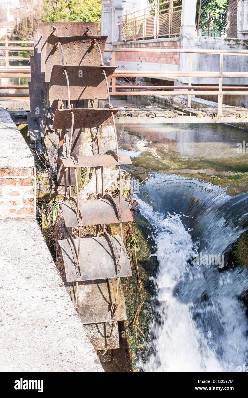 Old iron wheel a watermill. Ruins of a watermill Stock Photo - Alamy