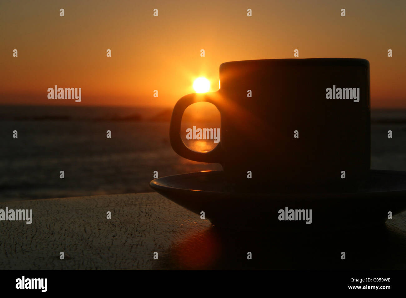 A silhouette of a coffee in a Sunset Stock Photo - Alamy