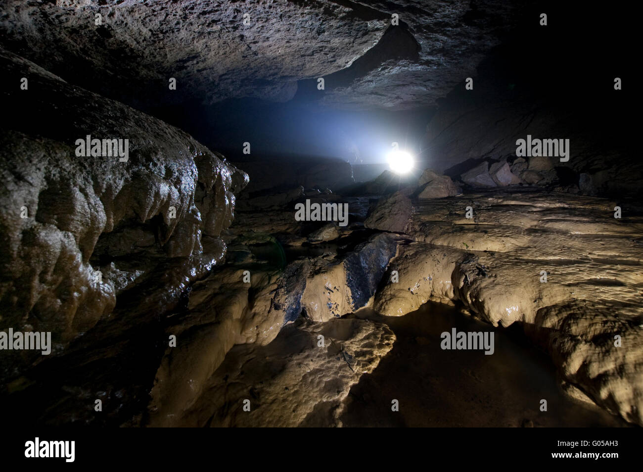 light at the entrance of a dark cave Stock Photo - Alamy