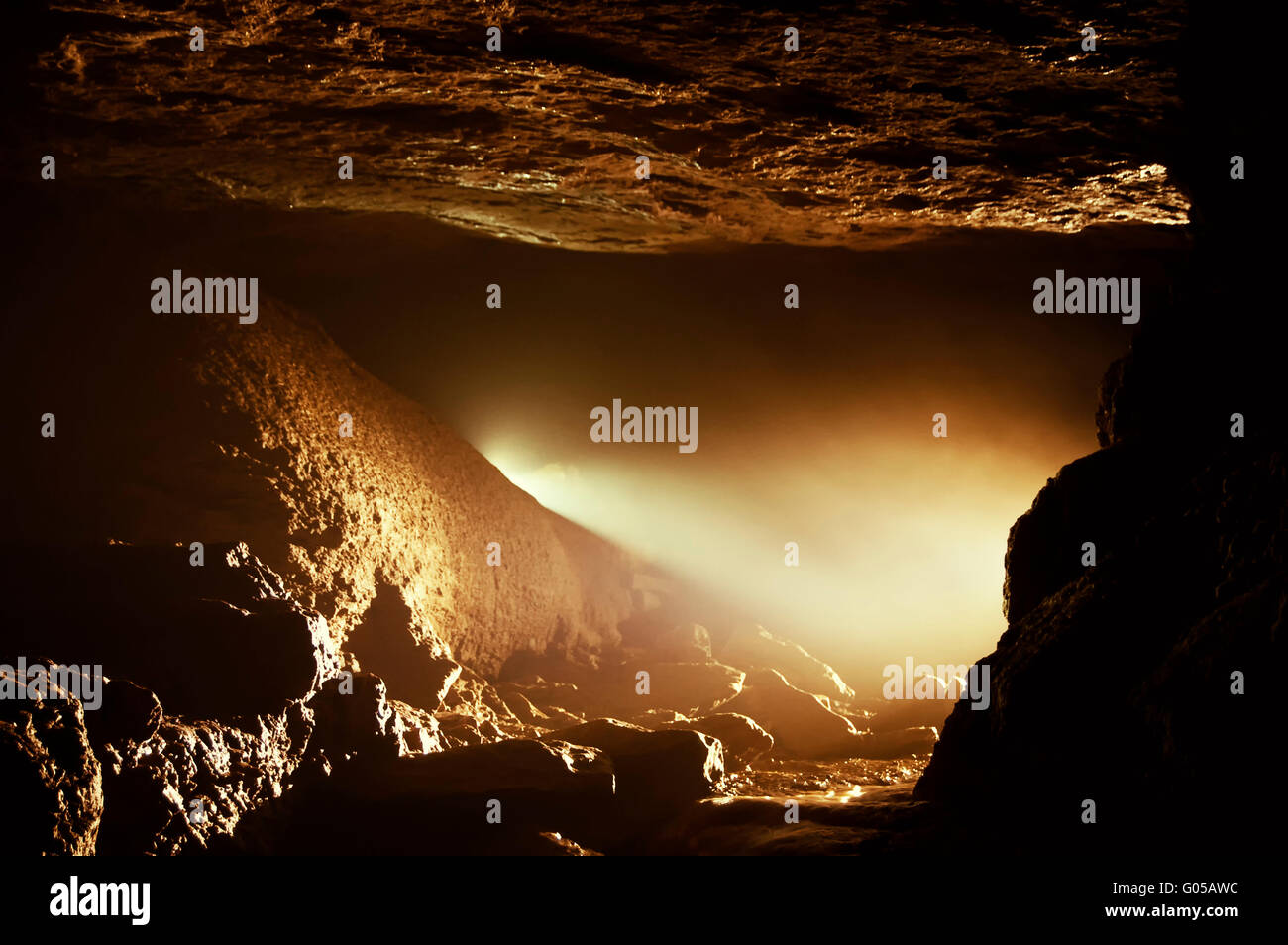 light at the entrance of a dark cave Stock Photo - Alamy