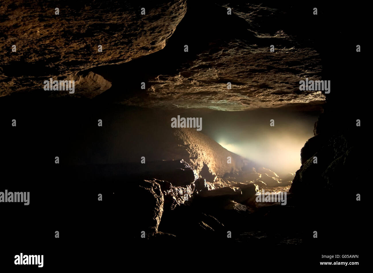 light at the entrance of a dark cave Stock Photo - Alamy