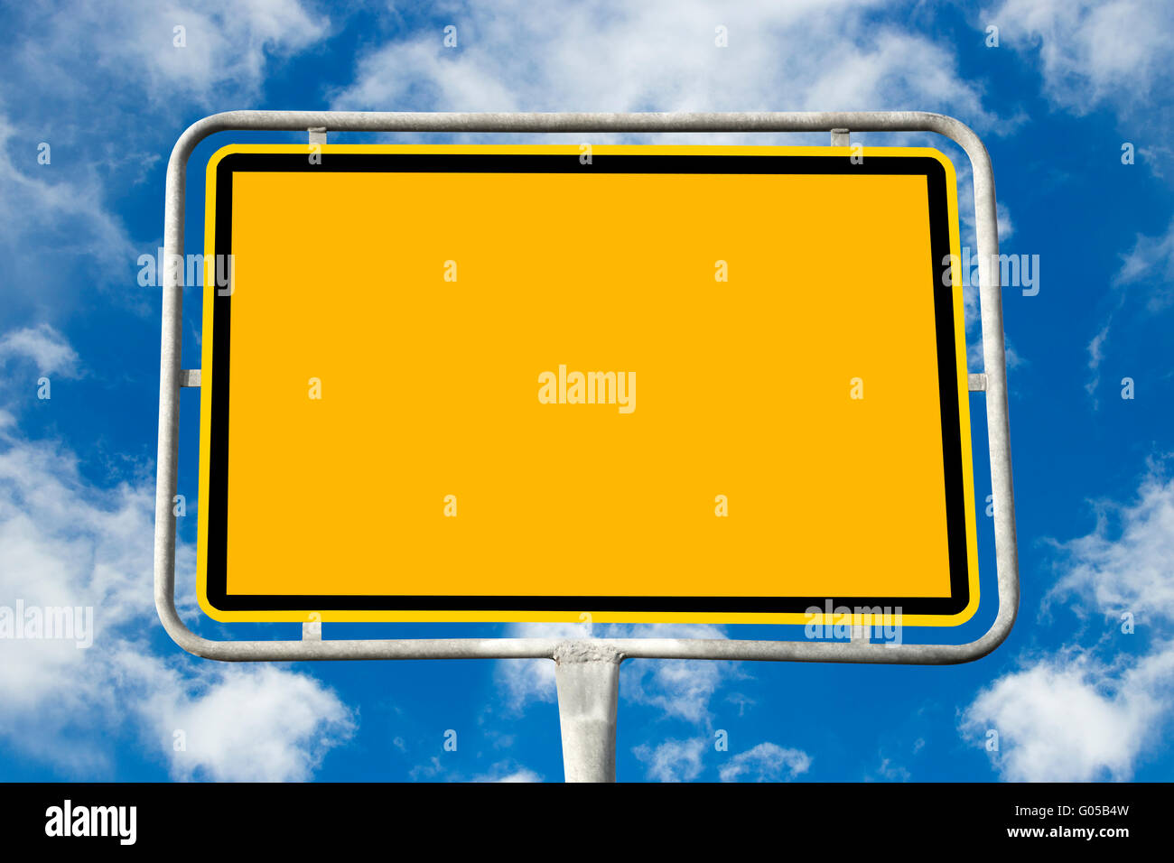 Yellow signpost for template in front of blue sky with clouds Stock ...