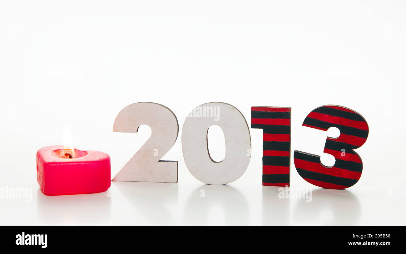Wooden 2013 year number with a burning candle Stock Photo - Alamy