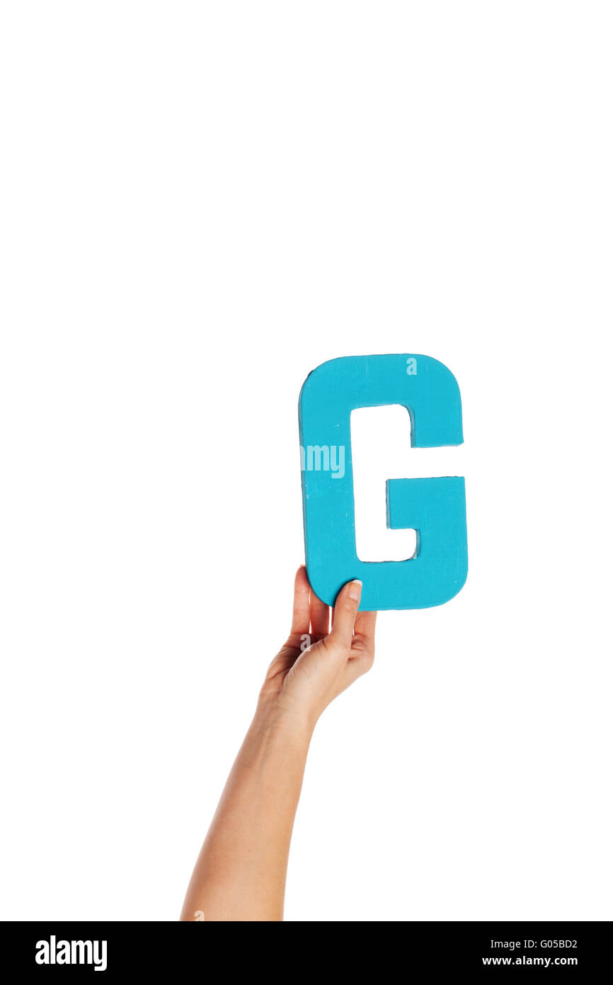 hand holding up the letter G from the bottom Stock Photo - Alamy