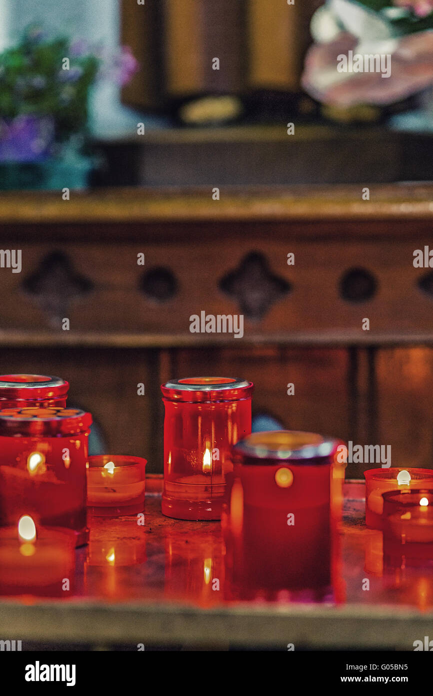 red candles in Catholics church Stock Photo - Alamy