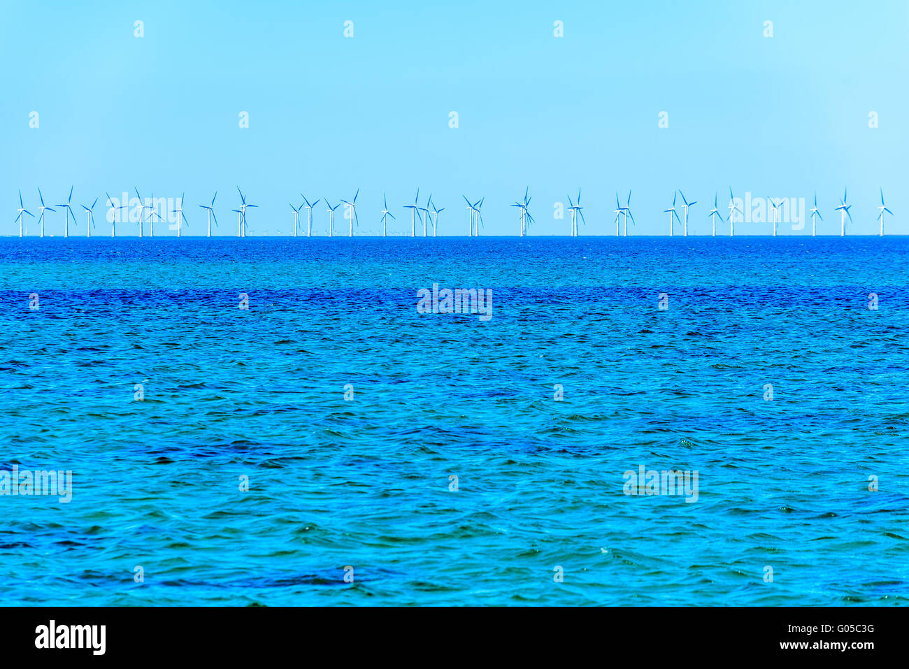 Offshore wind farm or wind park against the horizon in open and calm ...