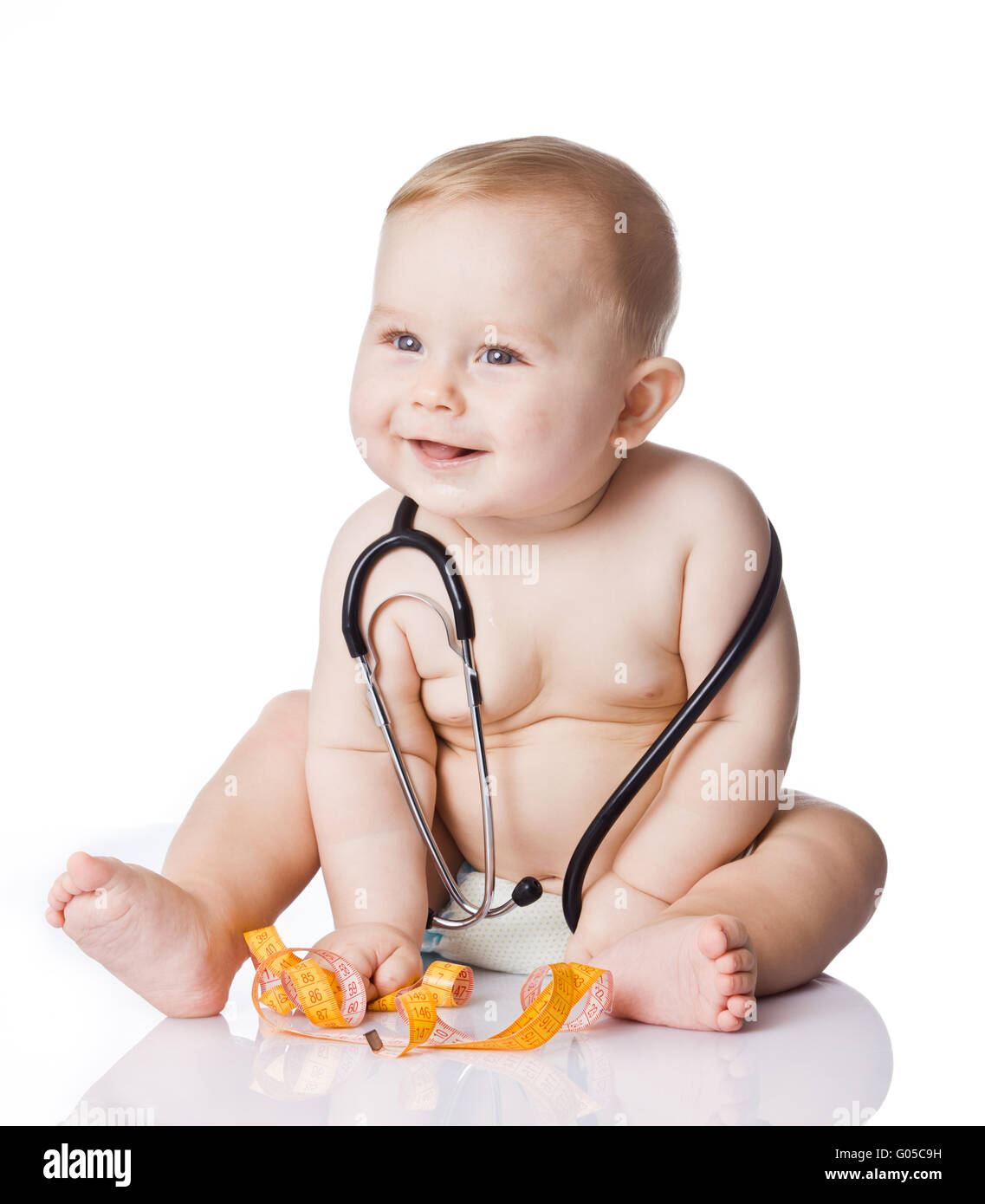 Sweet baby with stethoscope and measure tape on a Stock Photo - Alamy
