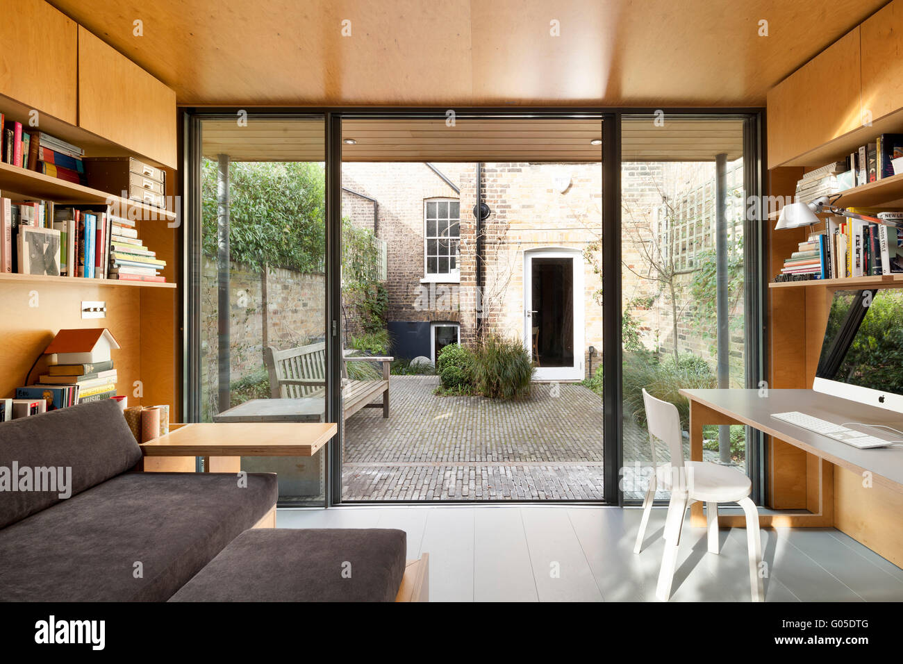Square return view of garden office interior. London townhouse, London, United Kingdom ...