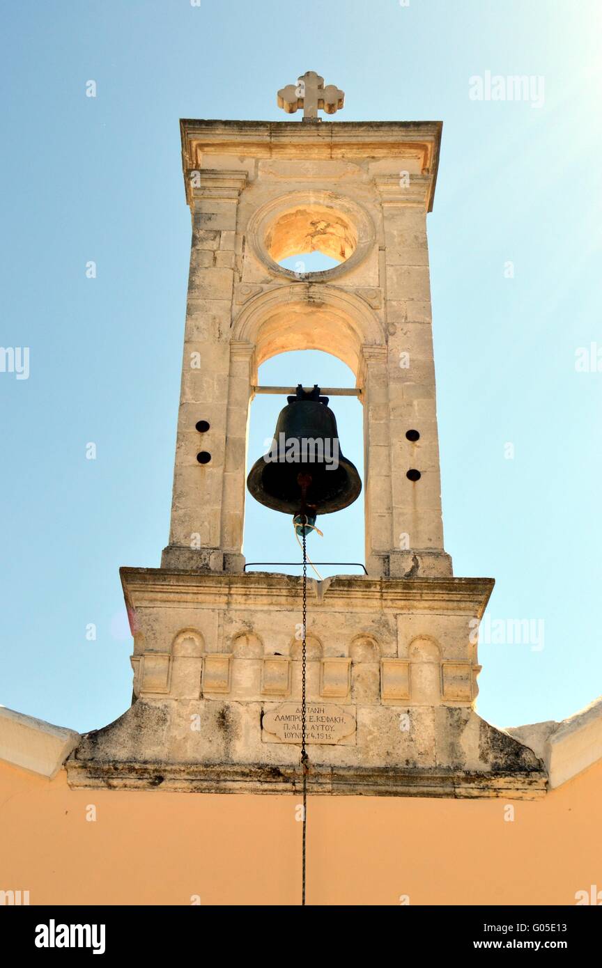 A white bell tower of color with a bell an eye of ox Stock Photo - Alamy