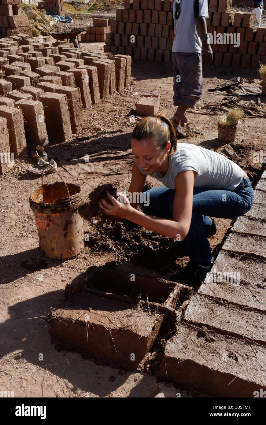A tourist making mud bricks in Cusco, Peru Stock Photo - Alamy