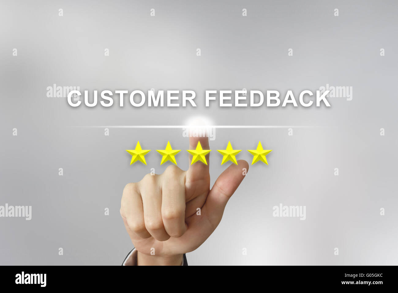 business hand clicking customer feedback with five stars on screen ...
