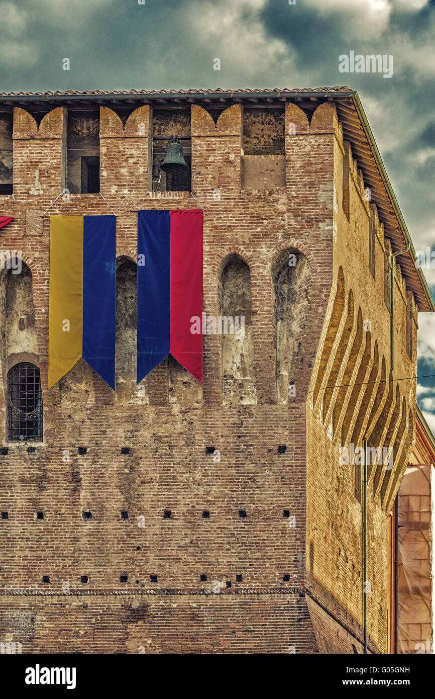 medieval castle with banners in Italy Stock Photo - Alamy